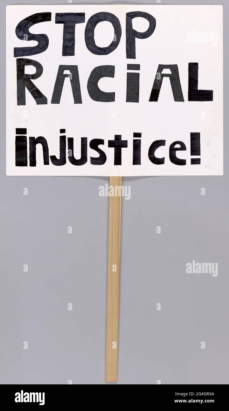 This cardboard sign is a rectangular piece of cardboard with ...