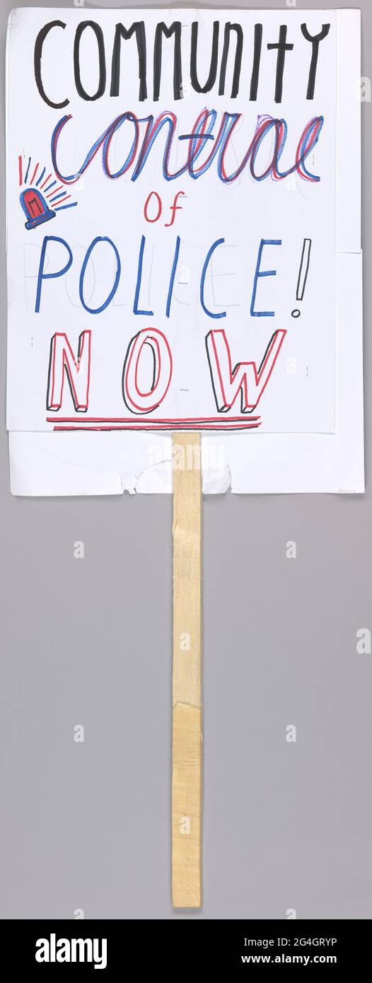 This placard demands community control of the police and states that ...