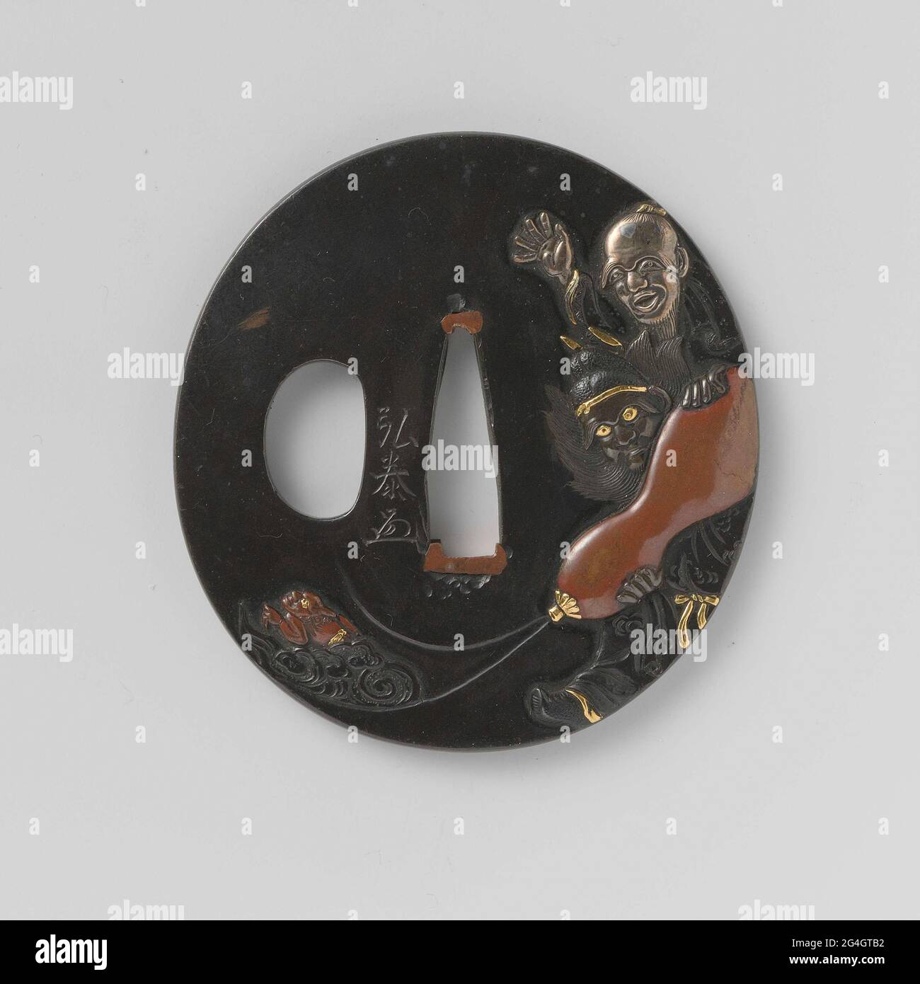 . Oval tsuba with at the front in Ire Takazogan and raised embossed ...