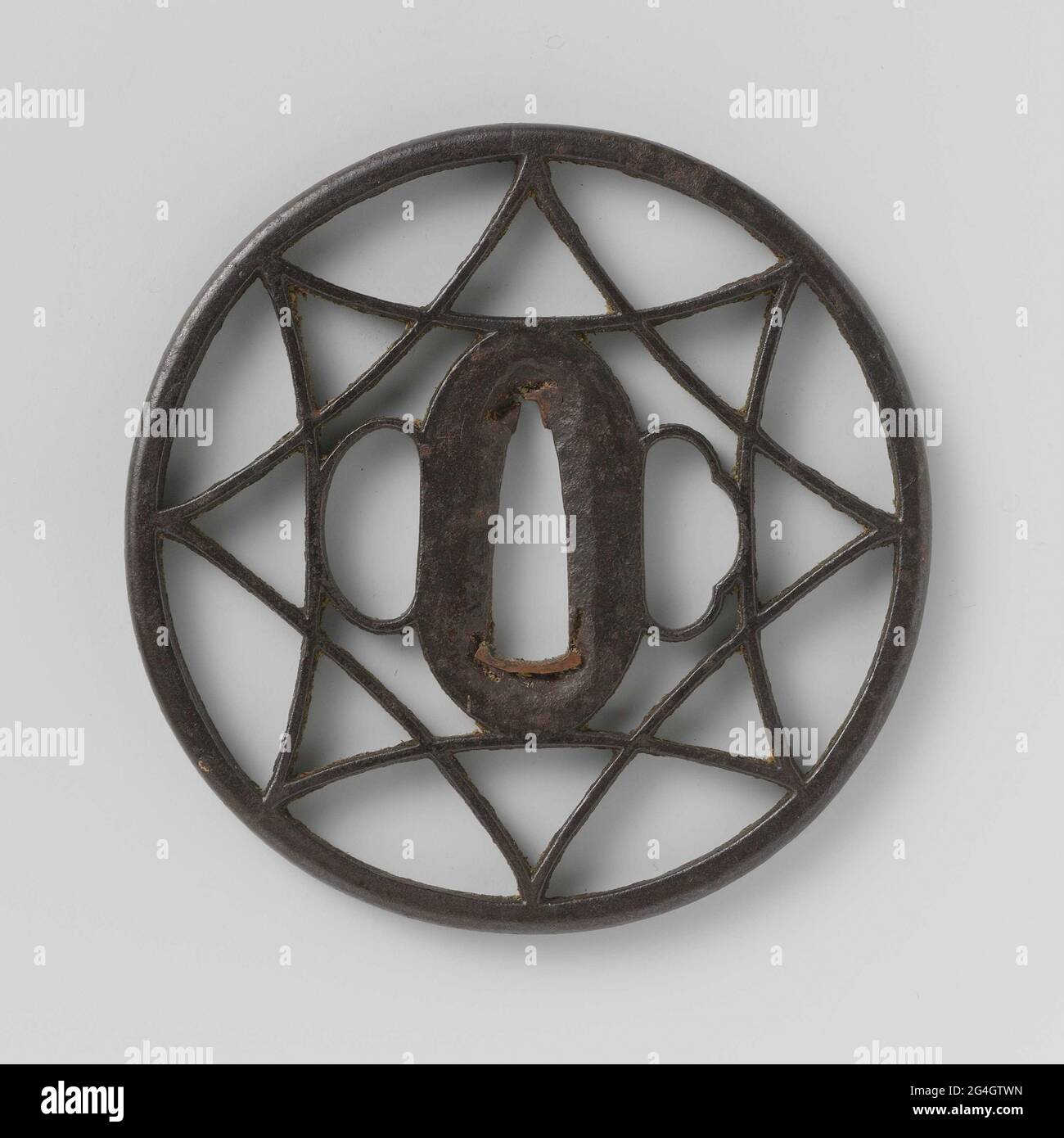 . Round tsuba with a opened decoration of an eight-pointed star Stock ...