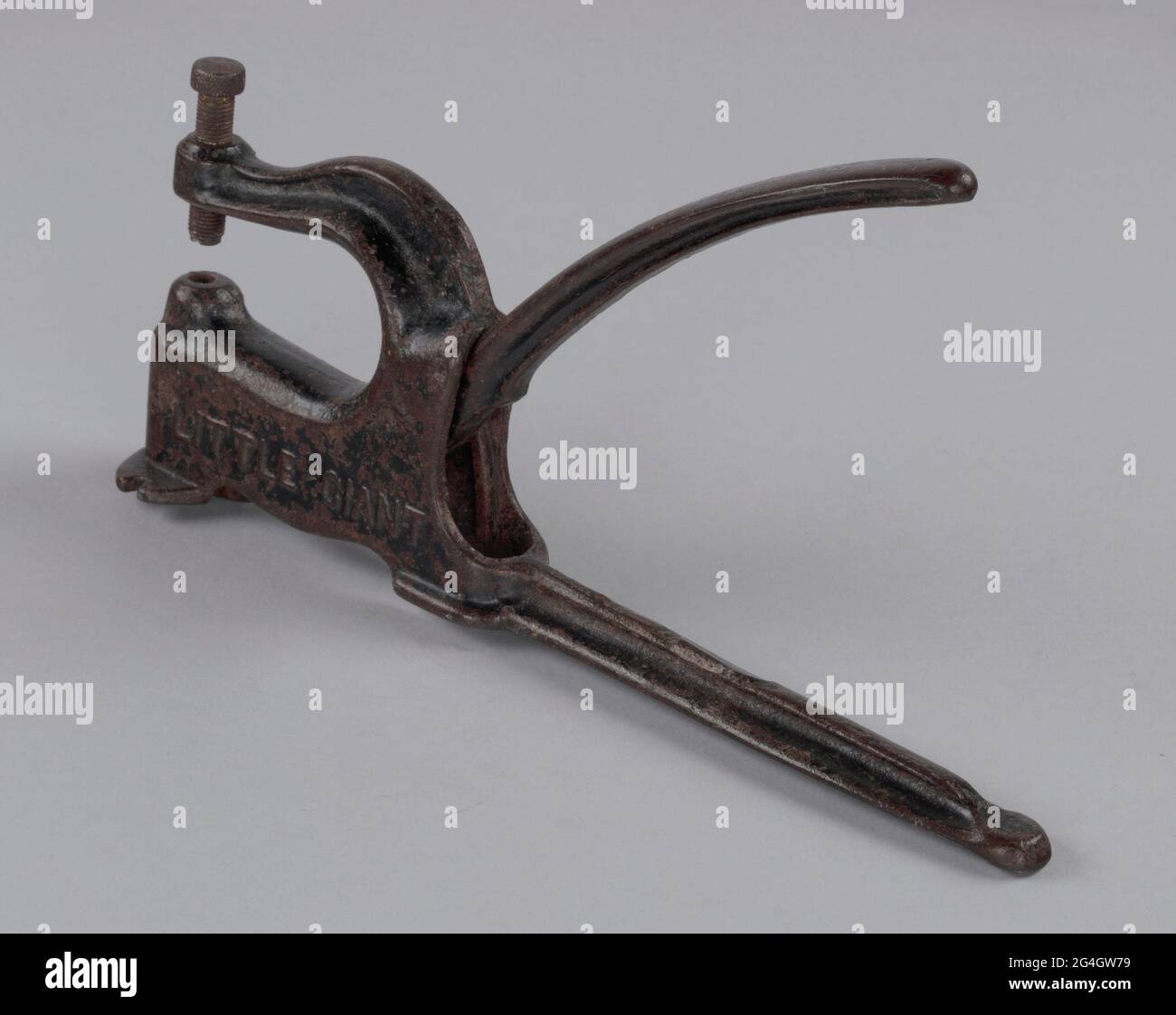 An iron Little Giant leatherworking riveter. The riveter has a long ...