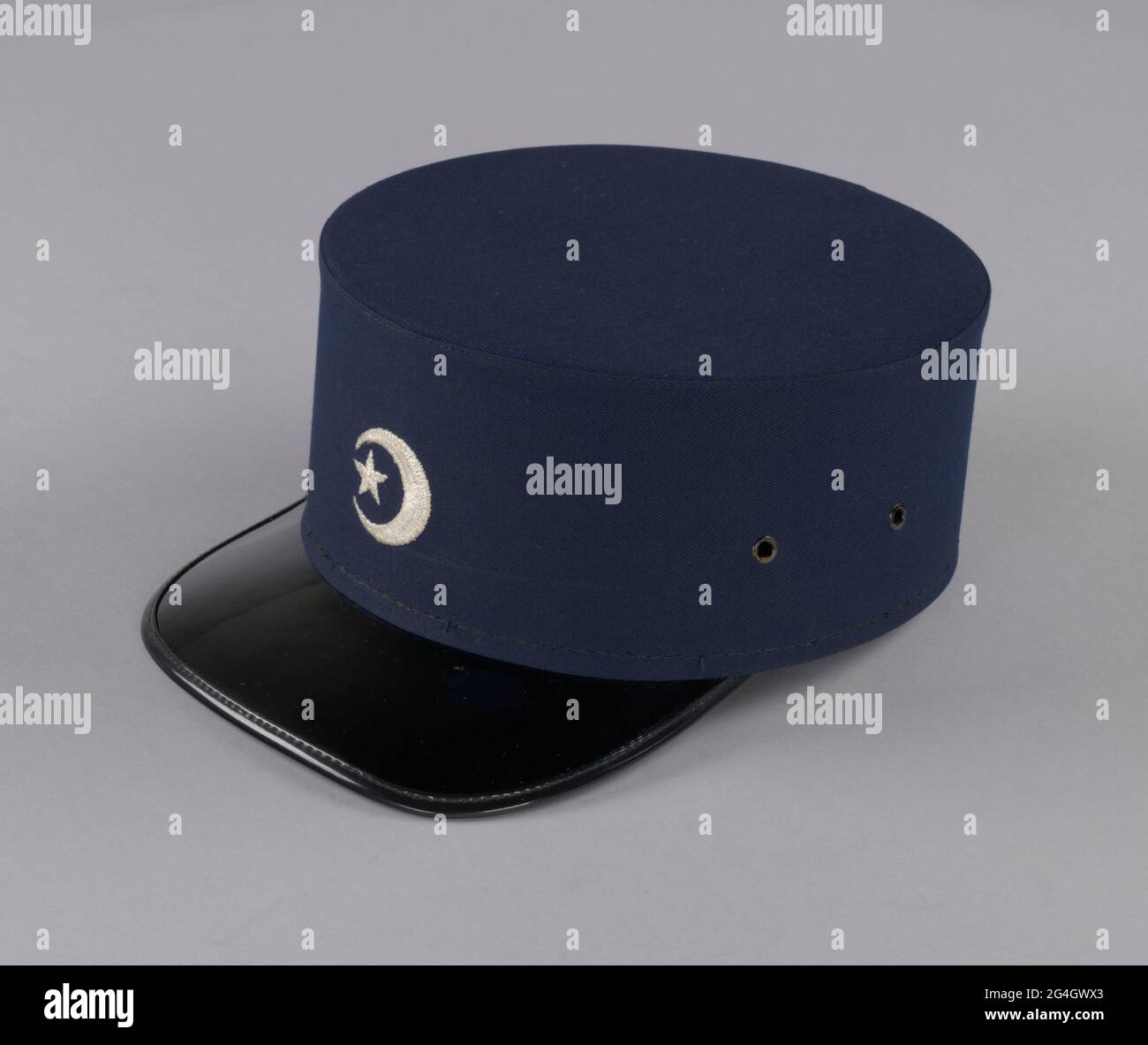 Navy blue cap with black patent leather bill; Nation of Islam crescent ...