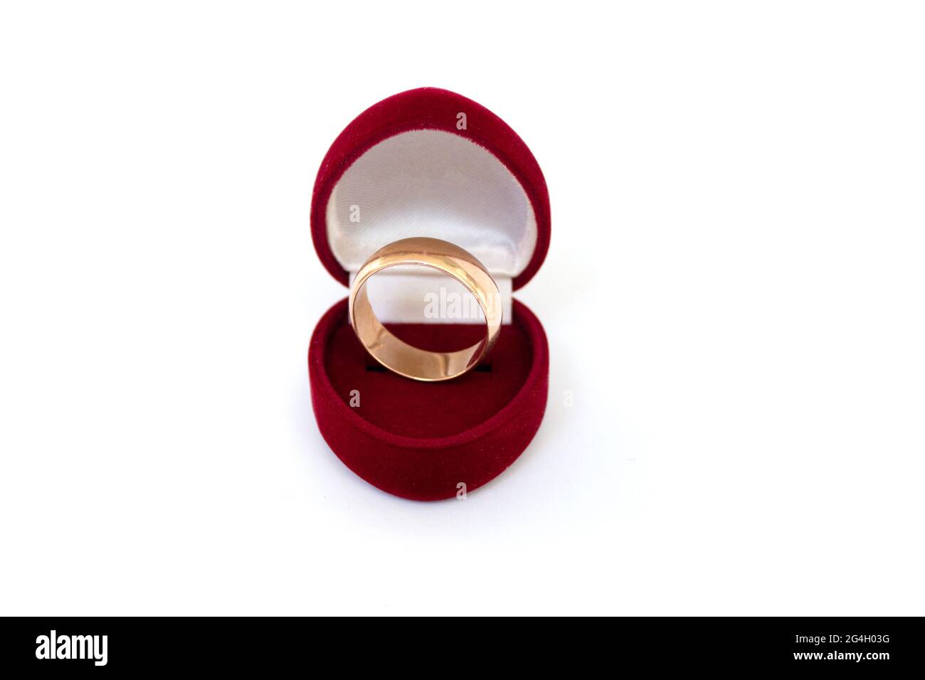 Wedding ring in red case on white isolated background Stock Photo - Alamy