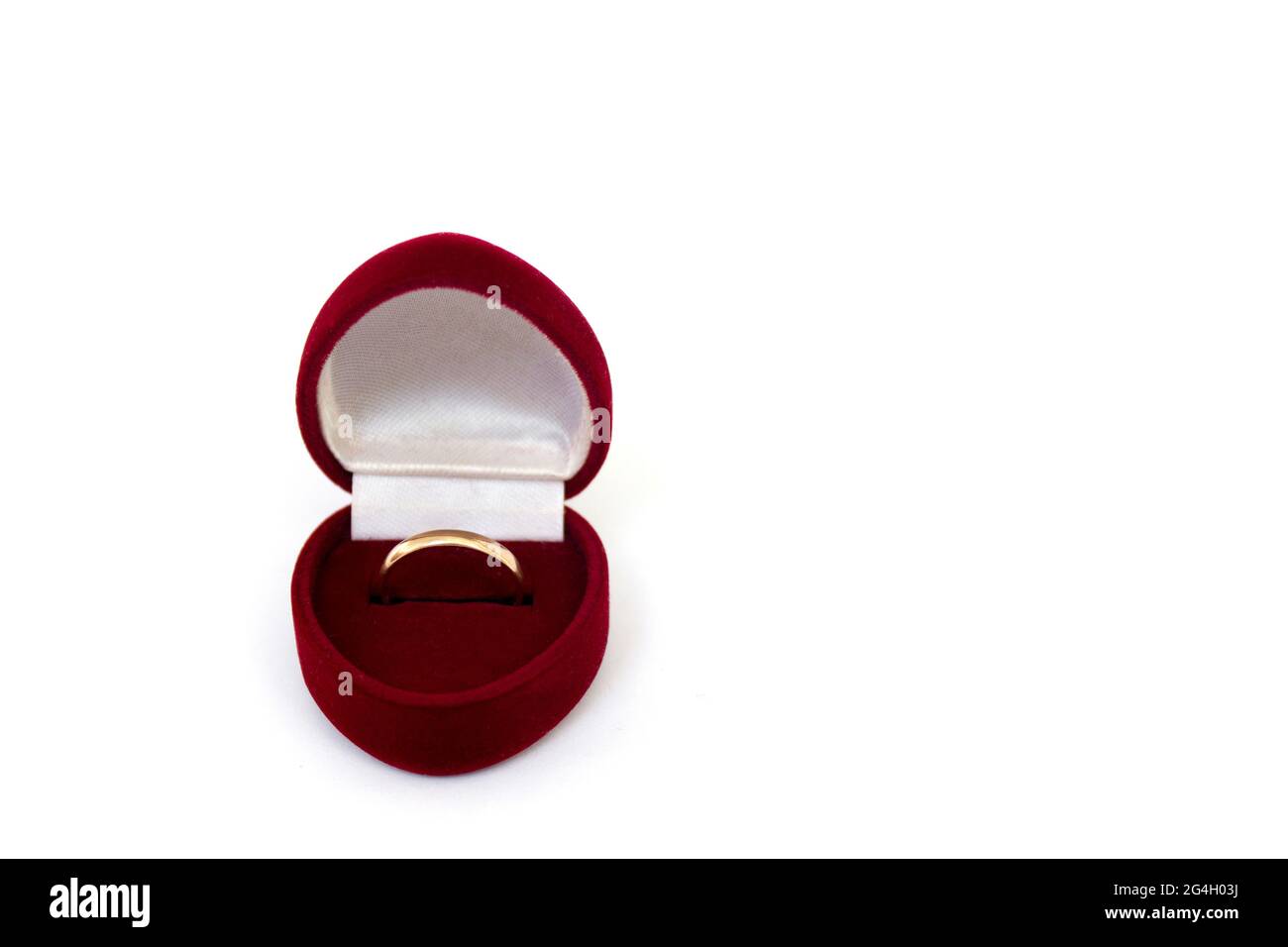 Wedding ring in red case on white isolated background Stock Photo - Alamy
