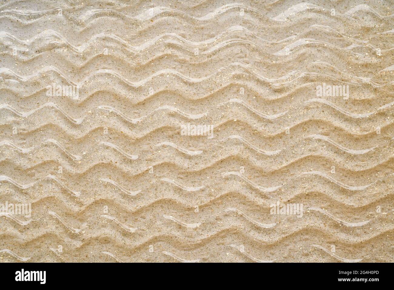 Transparent smear and texture of golden cosmetic gel on a white ...