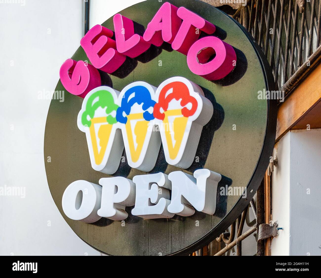 A colorful sign above a homemade Italian ice-cream shop in Cotacachi ...