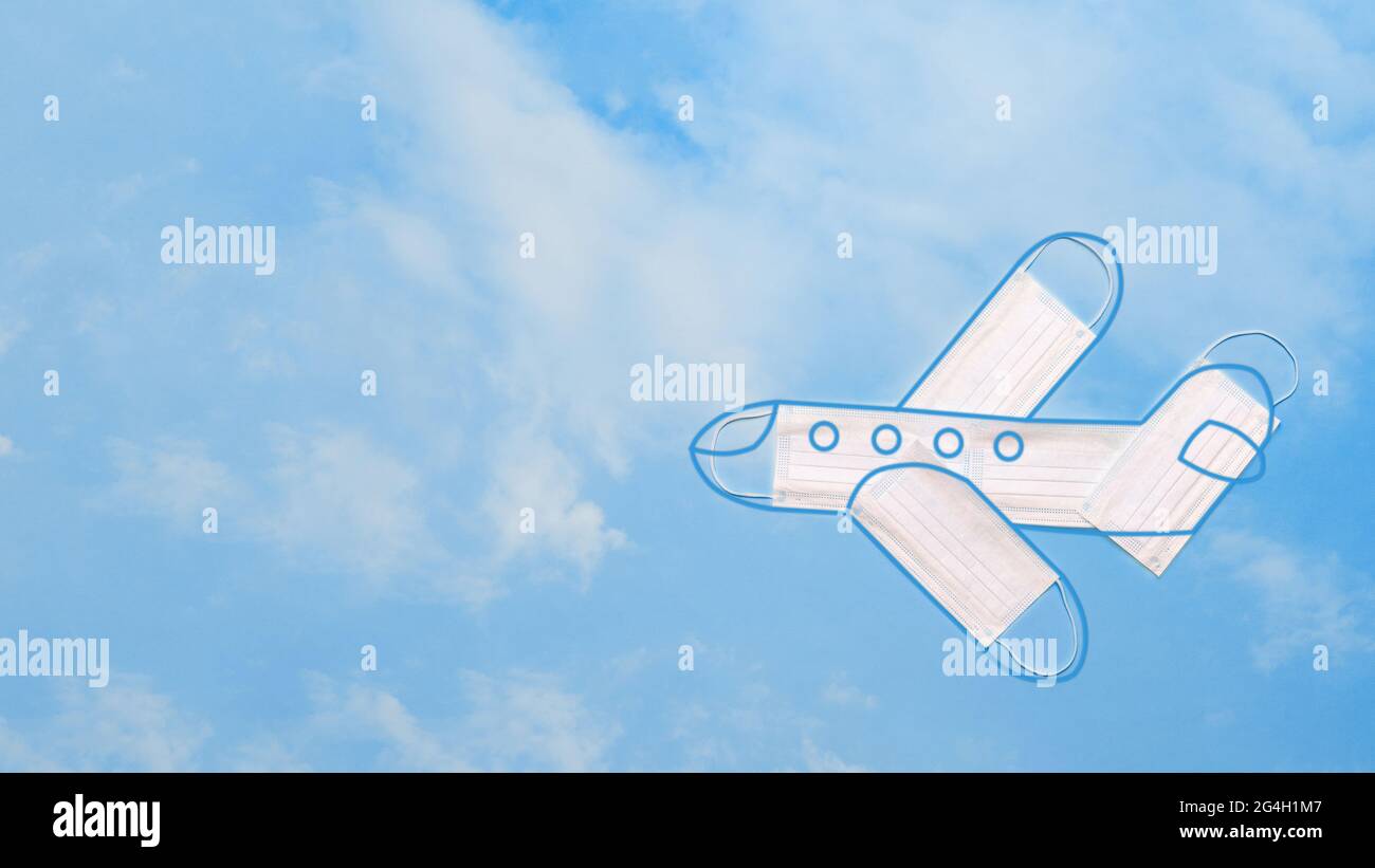 Airplane model made of protective masks with the outline of the ...