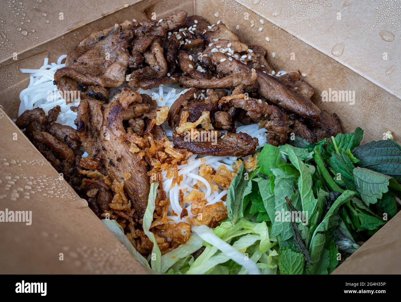 Vietnamese dish Bun Bo Nam Bo in a take out box - beef, noodles, bean ...