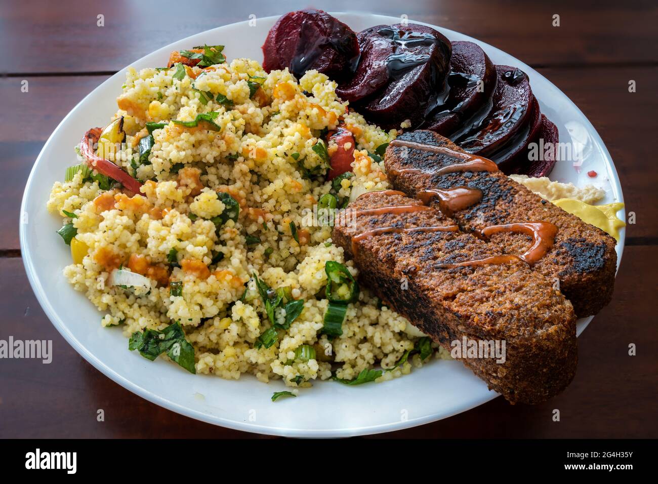 Vegan homemade dish with couscous seitan kebab and beetle root Stock ...
