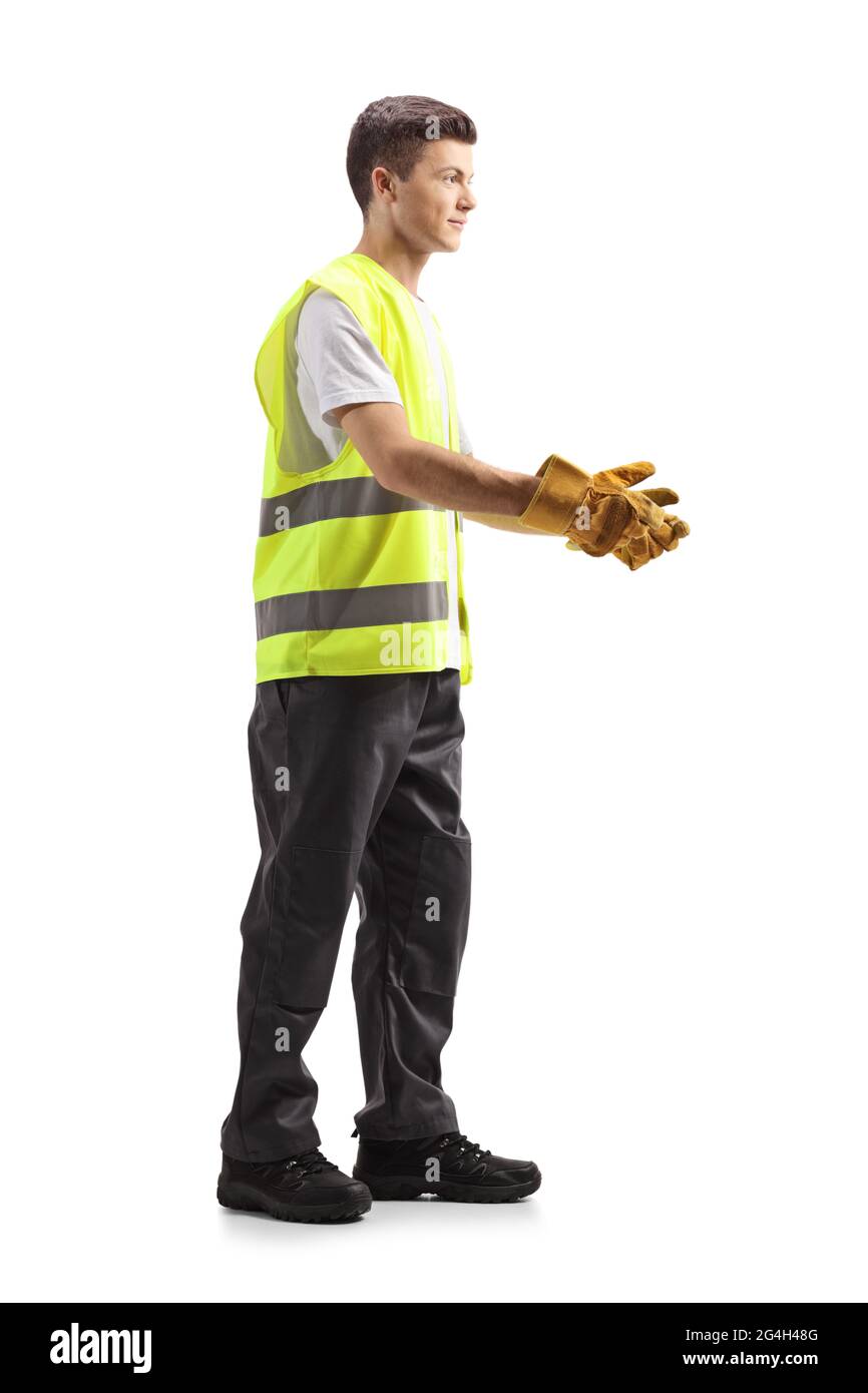 Full length profile shot of a young waste collector in a uniform and ...