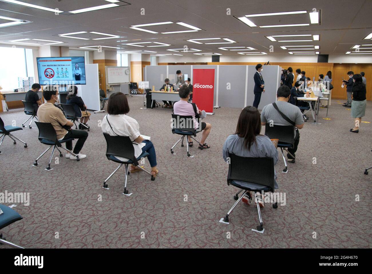 Tokyo, Japan. 21st June, 2021. Employees wait to receive their Covid-19 ...
