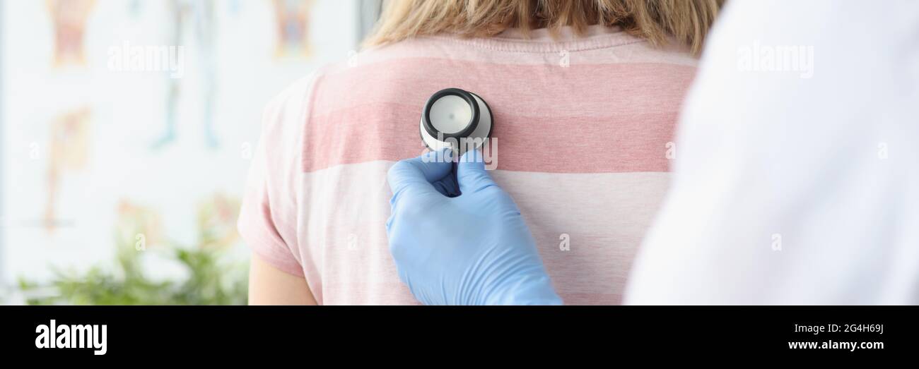 Doctor therapist listens to patient breathing with stethoscope Stock ...