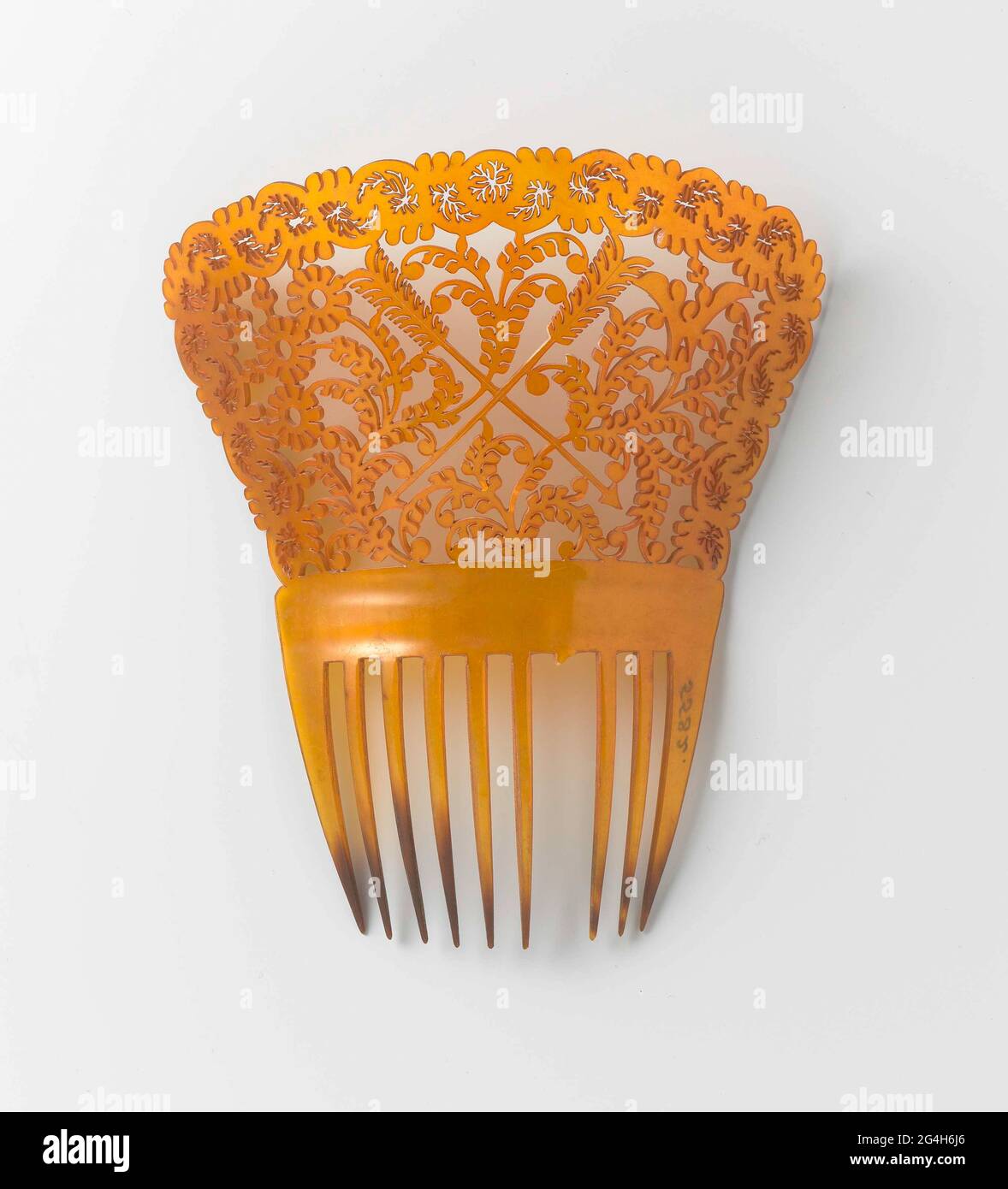 . Hair comb of blonde turtle and horn with high back. The comb is ajour ...