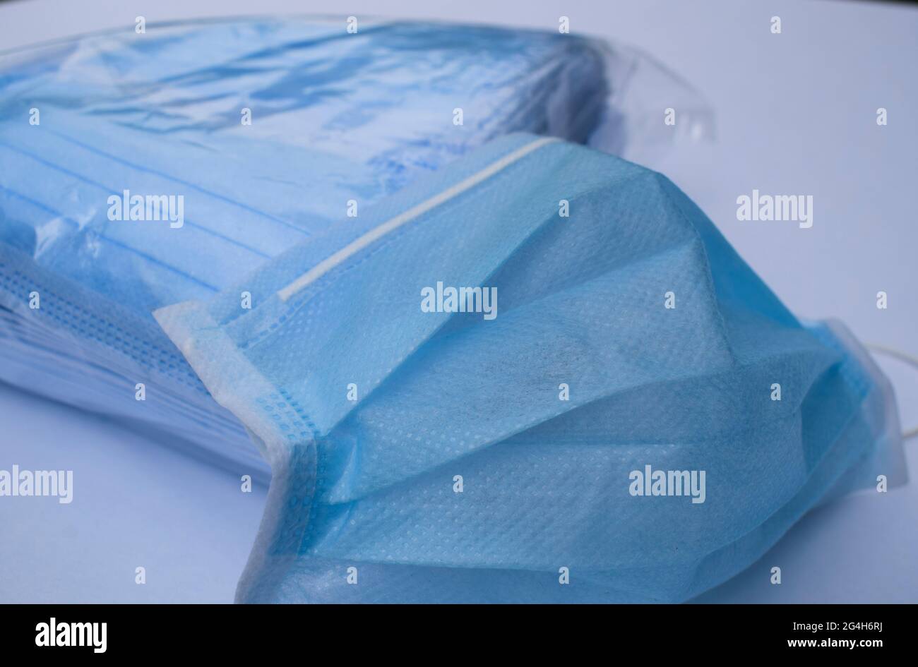 Package of many blue disposable surgical masks. Bundle pack of surgical ...