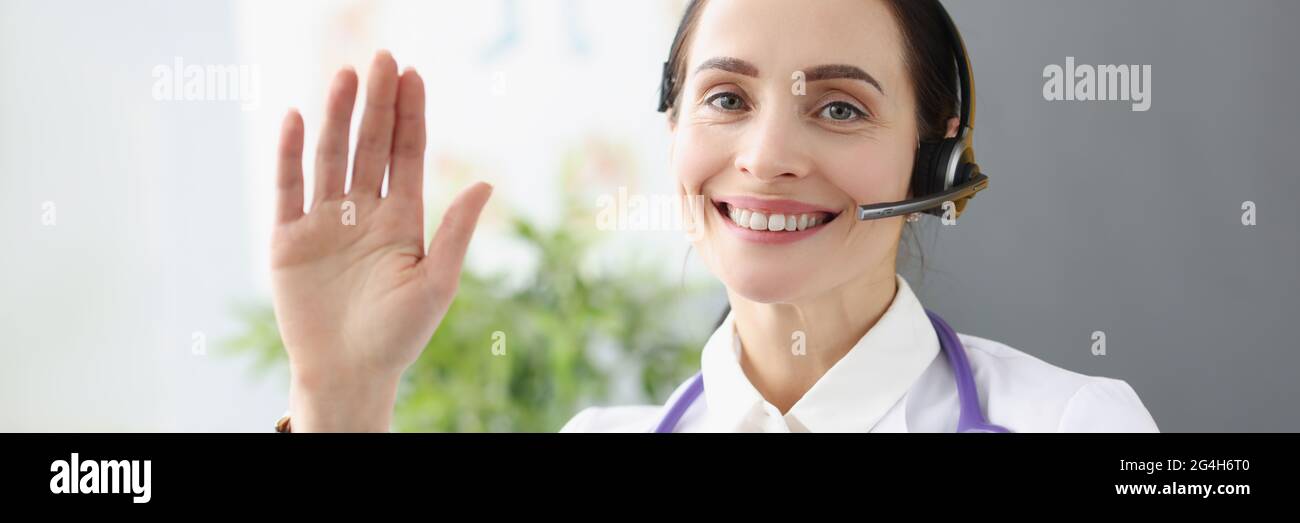 Doctor operator in call center holds his hand in greeting Stock Photo ...