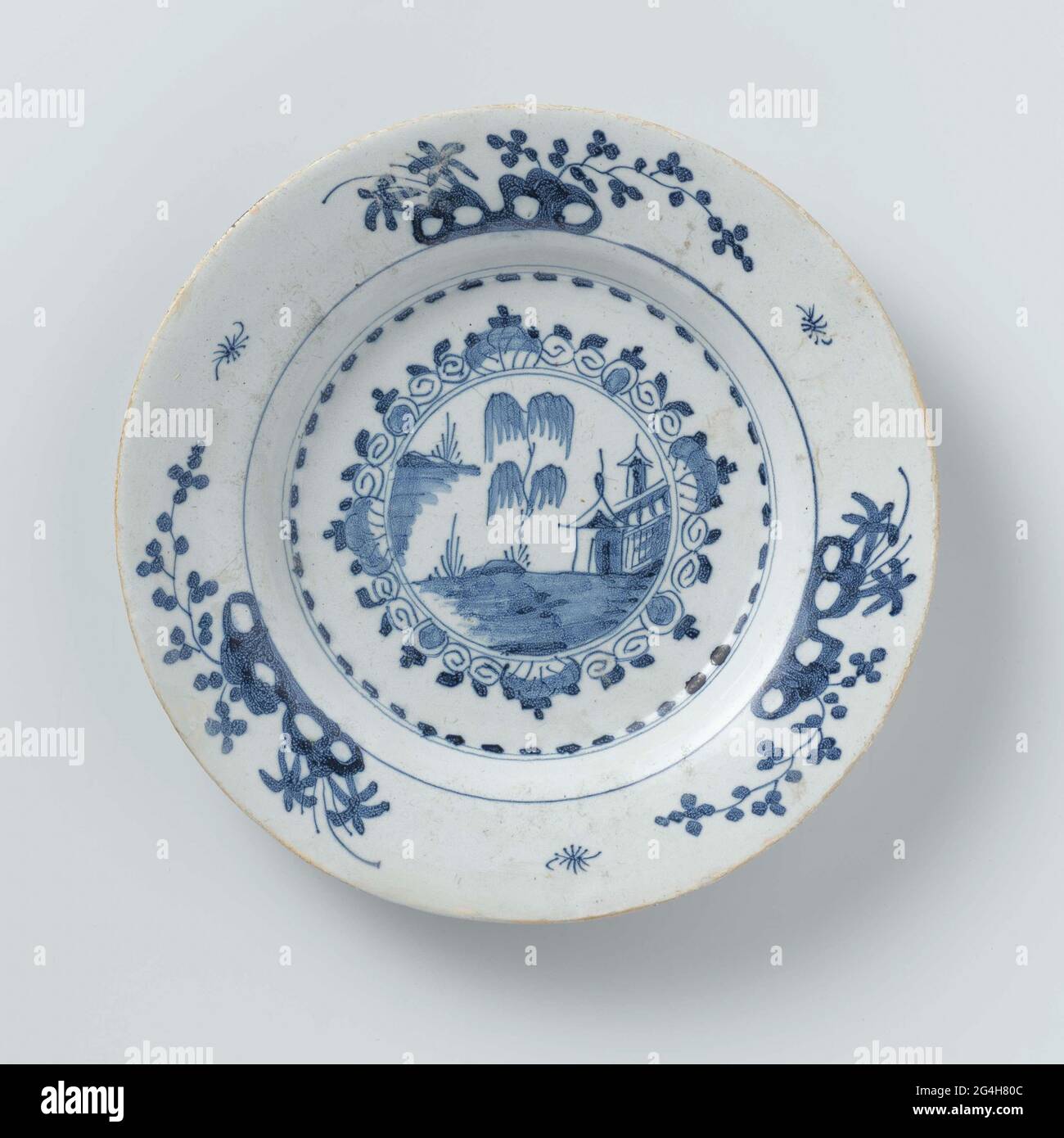 . Plate of faience. Painted blue Stock Photo - Alamy