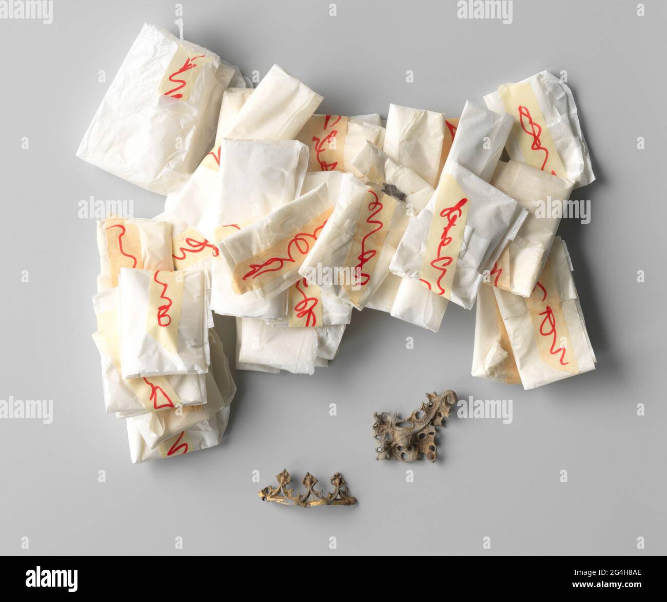 Box with lead and wooden fragments of the images and the retable ...