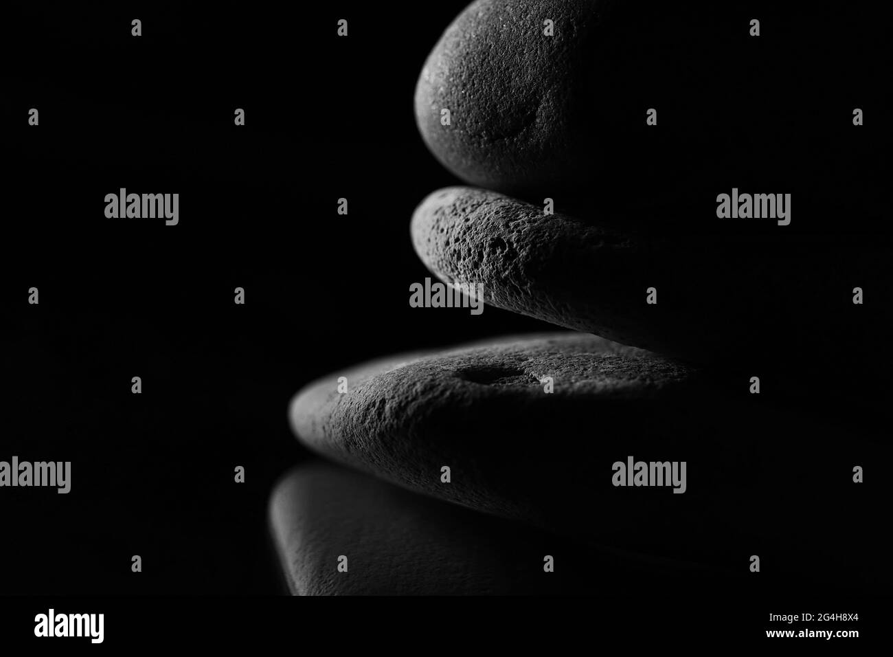 Three stacked stones hi-res stock photography and images - Alamy