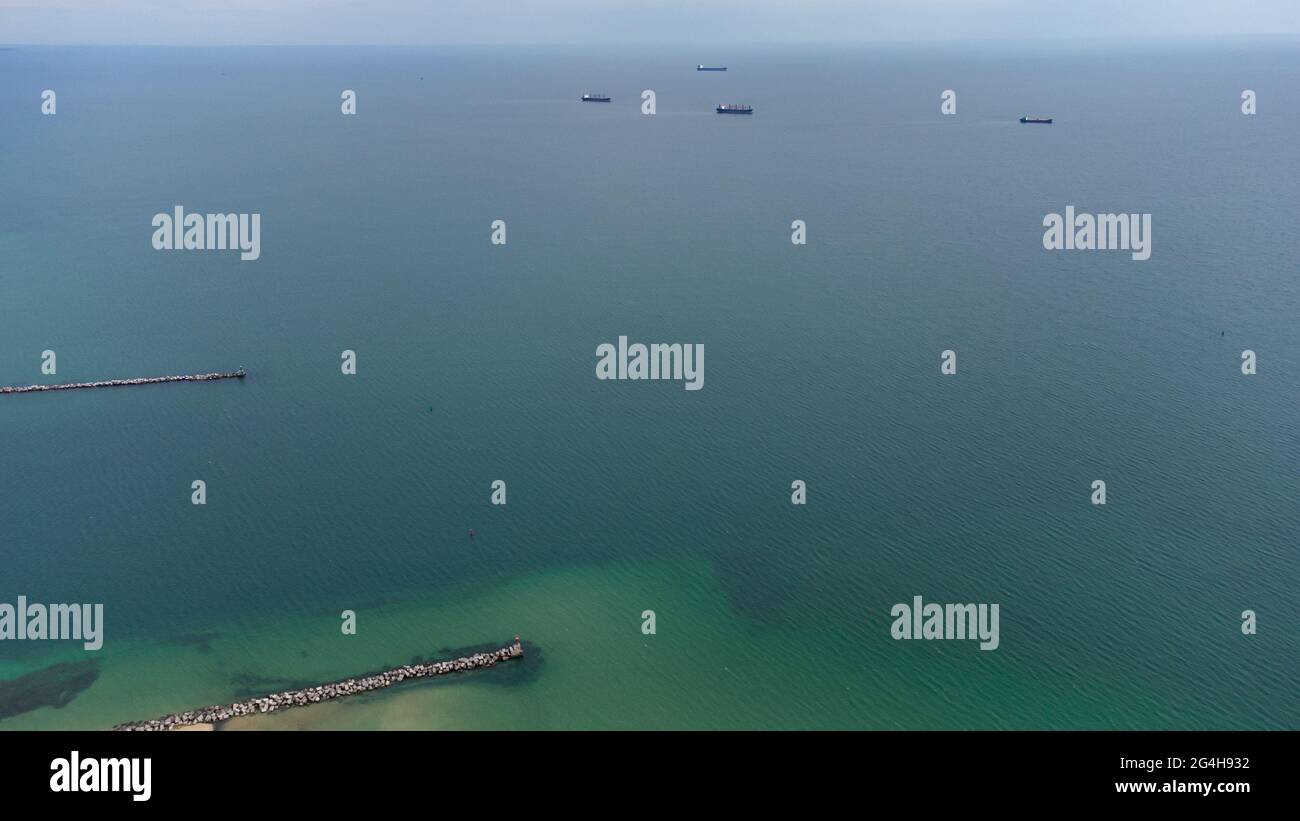 Cargo ships at the roadstead of the commercial port. Calm. Aerial view ...