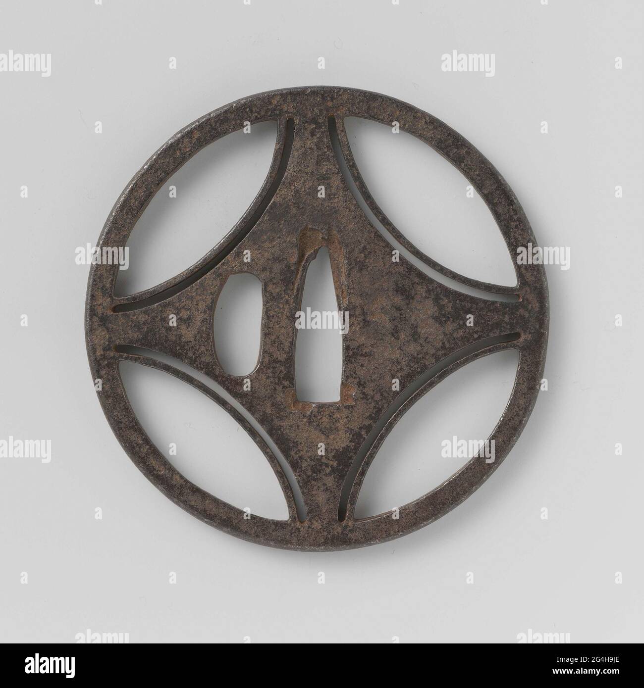 . Round tsuba with a simple openwork decoration of a square with ...