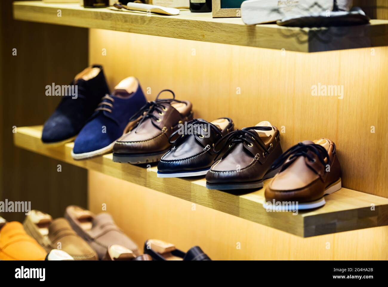 male leather shoes for sale in showcase of a modern store Stock Photo ...