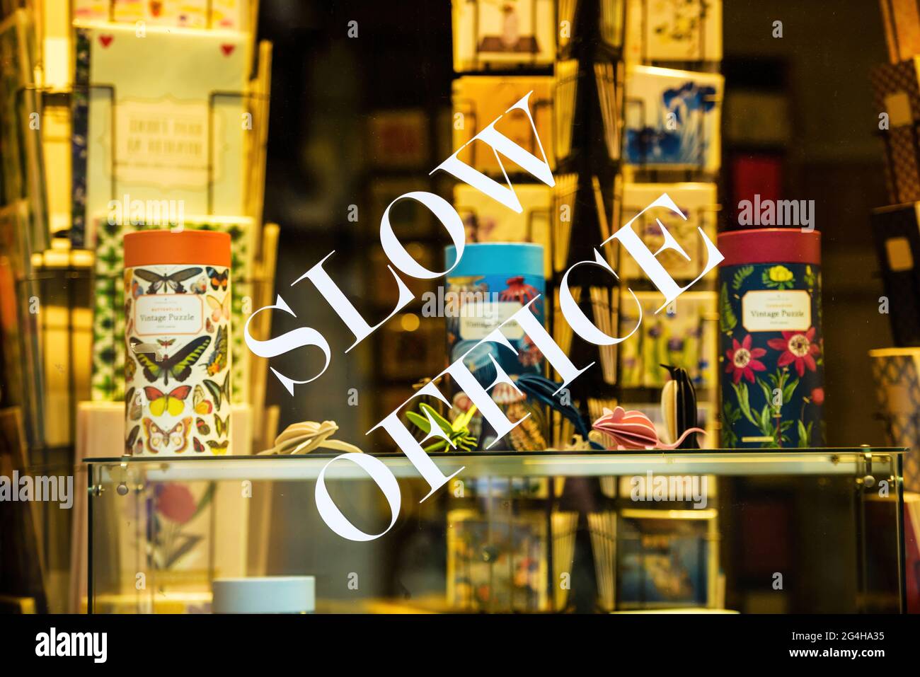Slow office inscription on the showcase of paper department store Stock ...