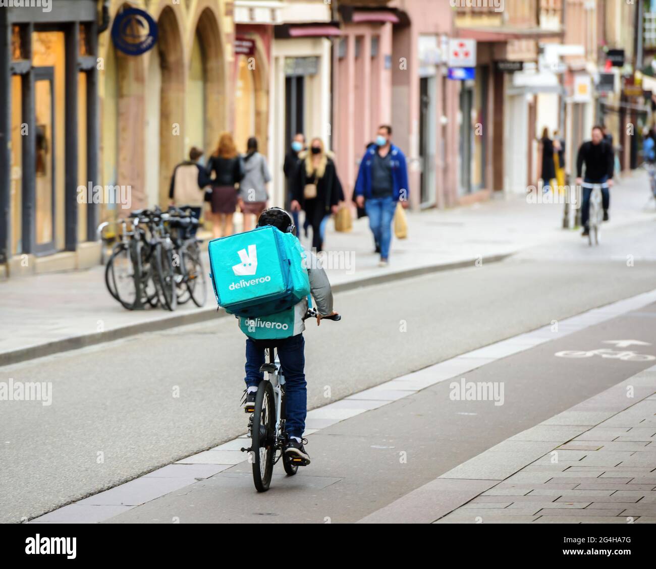 ear view of biker self-employede worker with Deliveroo sign Stock Photo ...