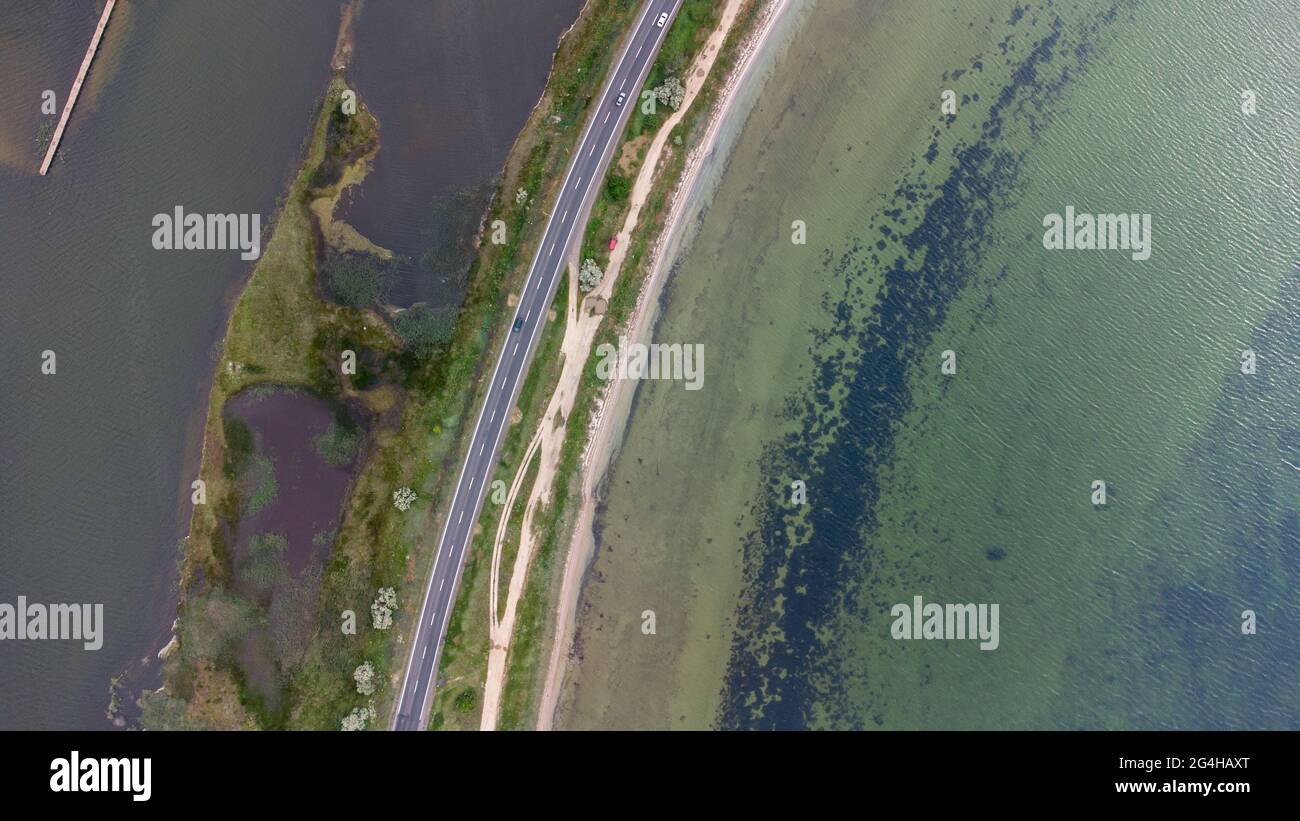 A highway that runs along a narrow spit between the sea and the estuary ...