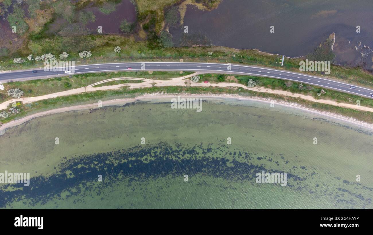 A highway that runs along a narrow spit between the sea and the estuary ...
