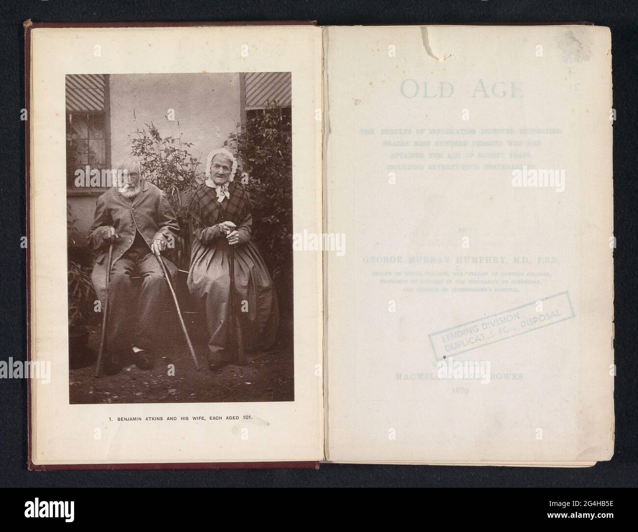 Portrait of Benjamin Atkins and his wife on a sofa in front of a house ...