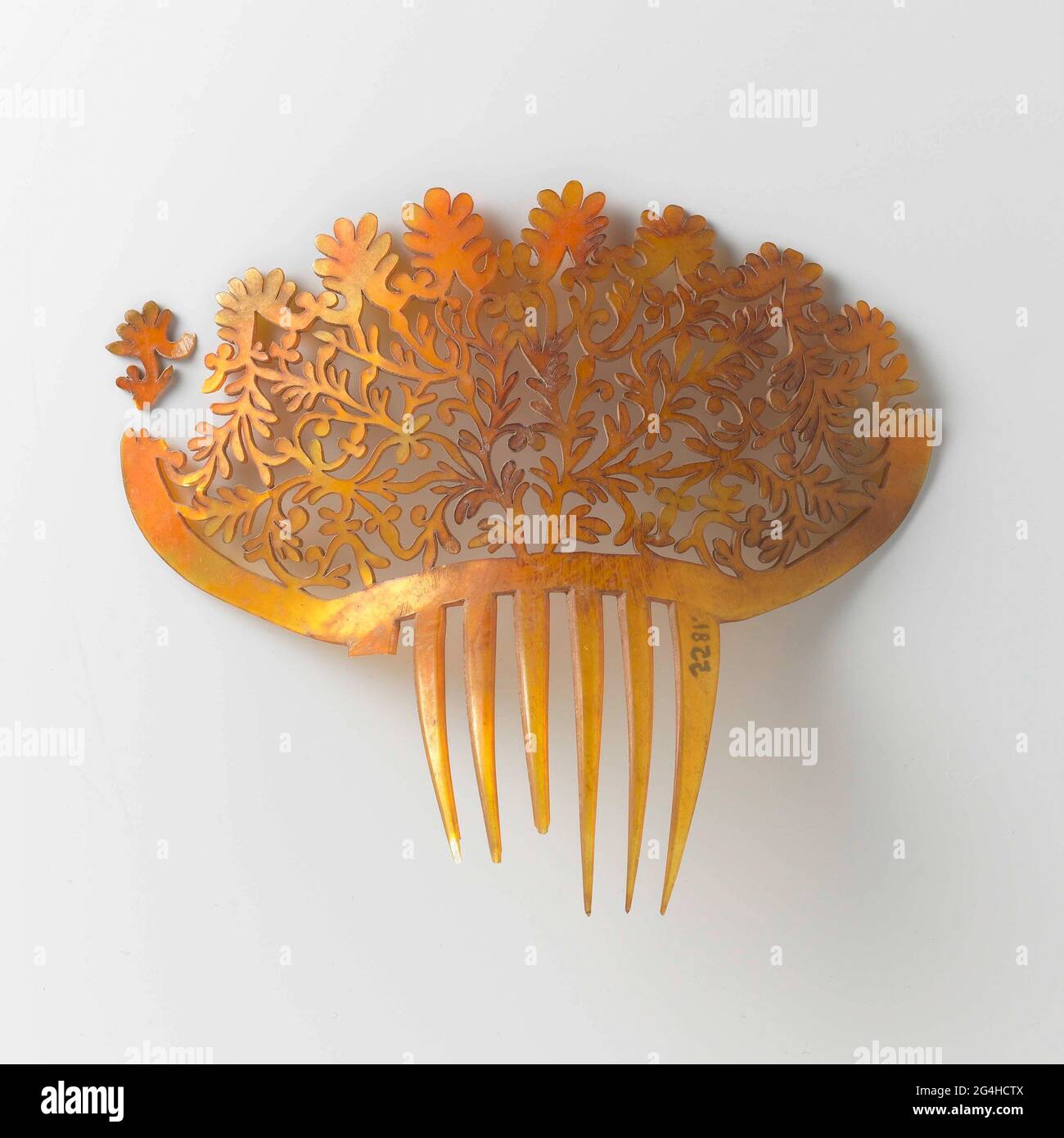 . Hair comb of blonde turtle and horn with ajour worked back in ...