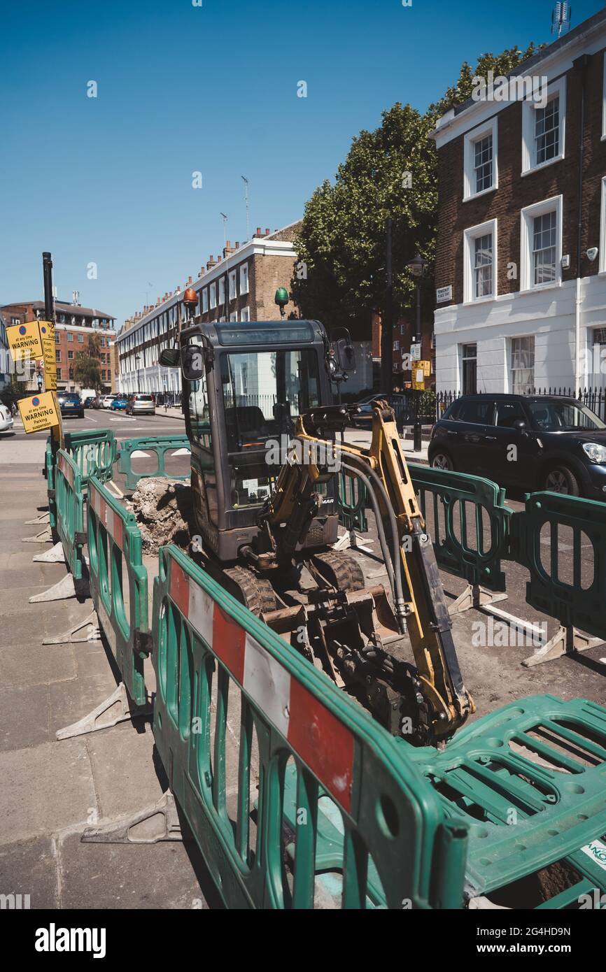 Vauxhall, London | UK - 2021.06.13: Small excavator at the road works ...