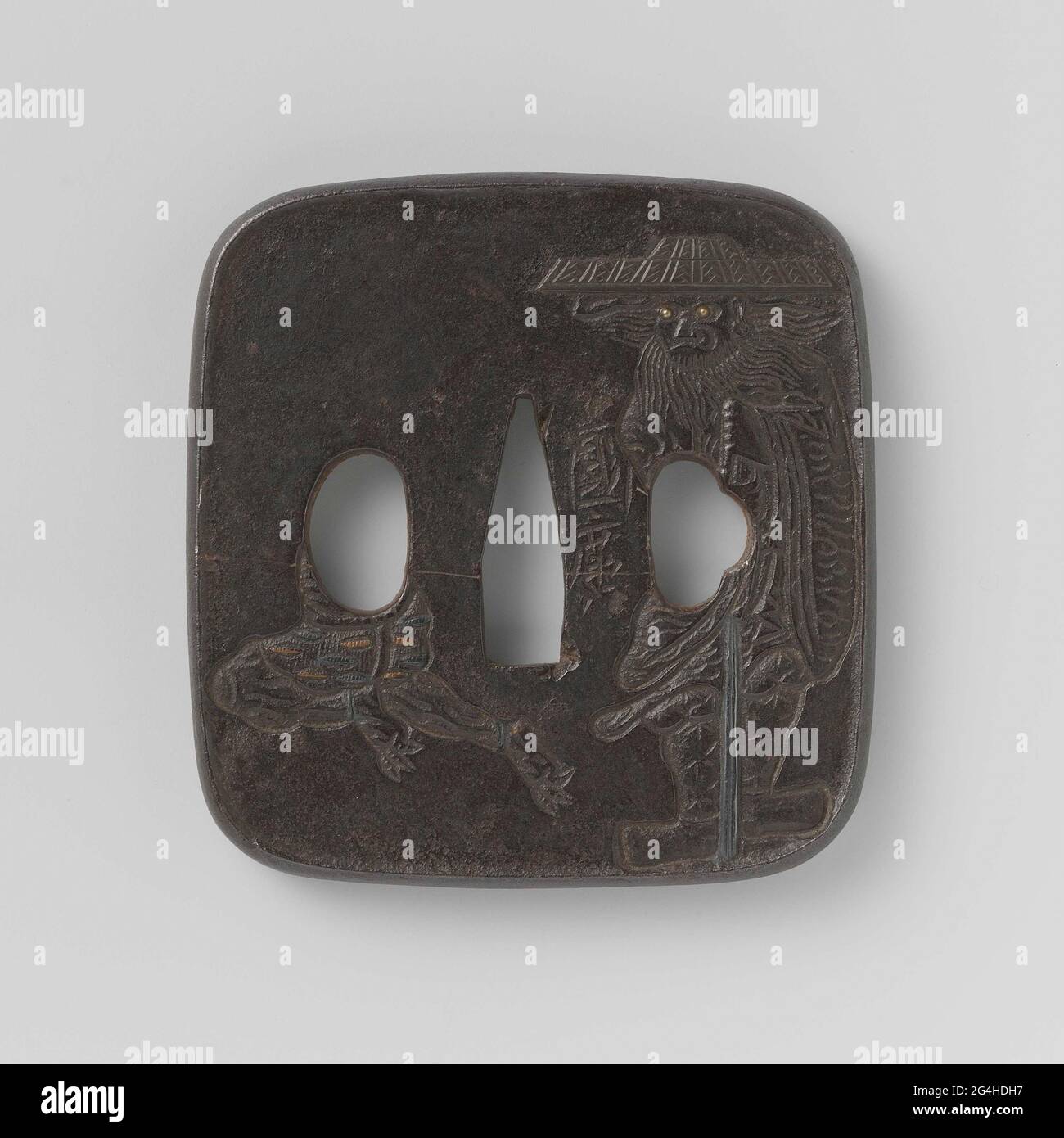 . Rounded rectangular tsuba with elevated edge; image in sunken relief ...