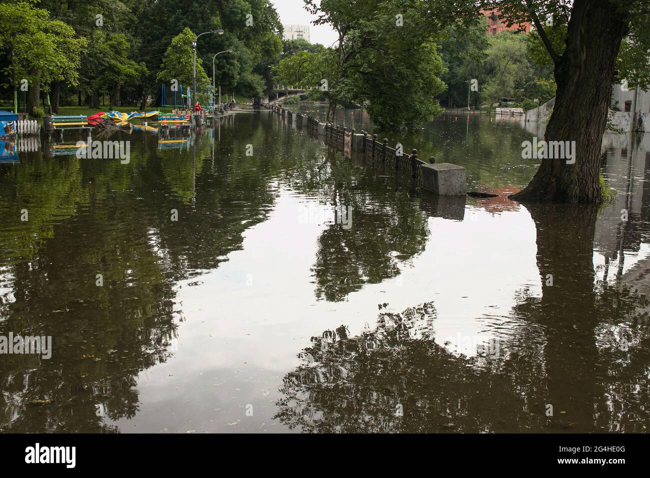 Public park drenched in rain. Water logged park.Wet benches. Park ...