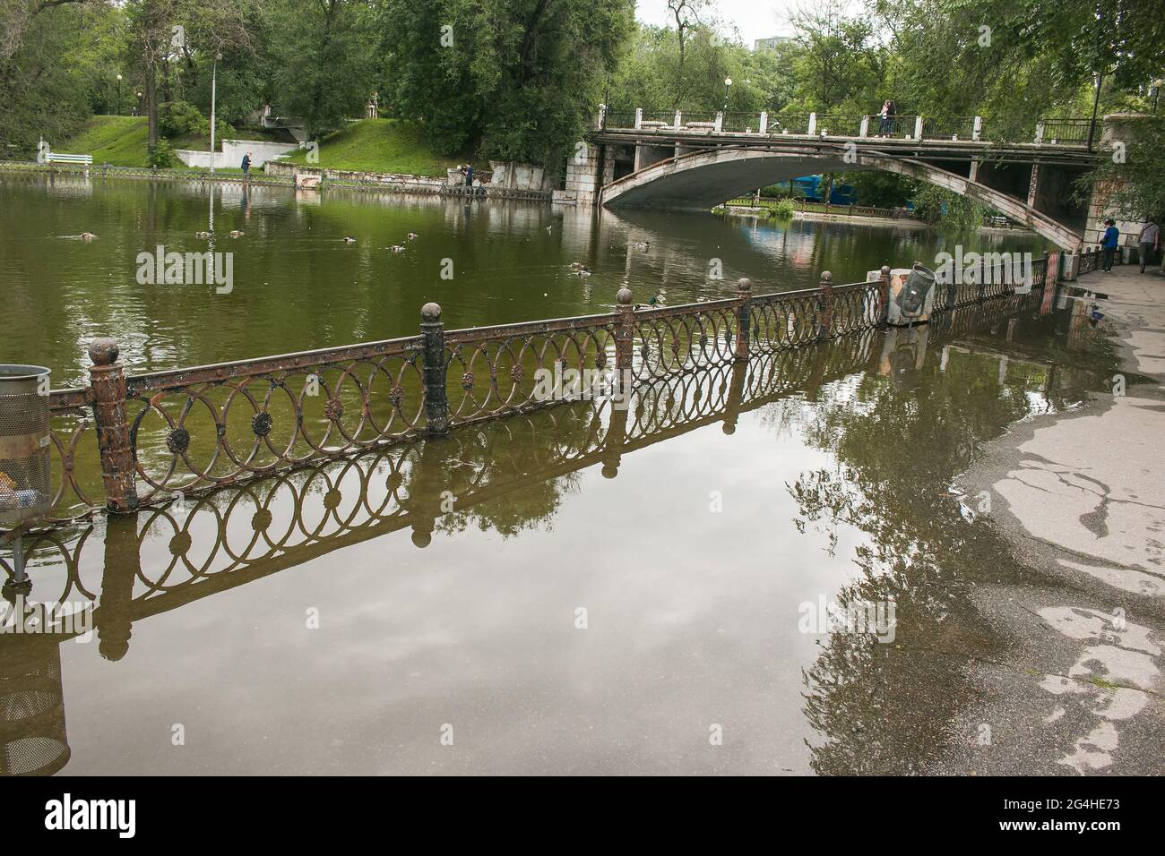 Public park drenched in rain. Water logged park.Wet benches. Park ...