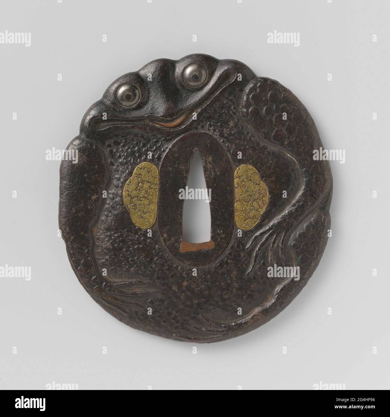 . Oval tsuba in the shape of a frog with silver eyes and a copper tongue; The Ryo-Hitsu are ...