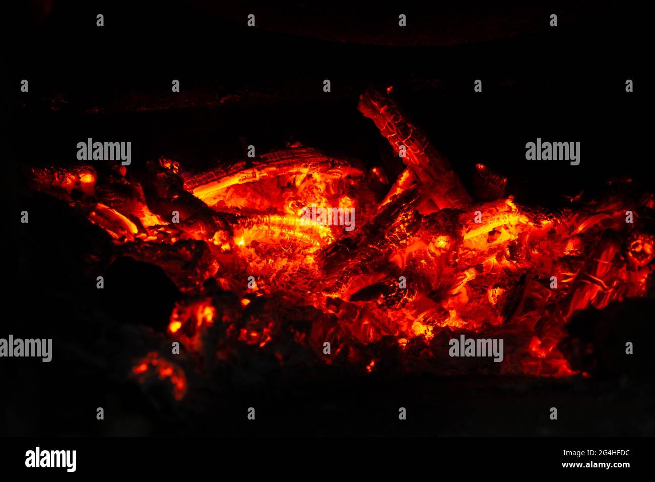 Burning wood and coal in the dark Stock Photo - Alamy