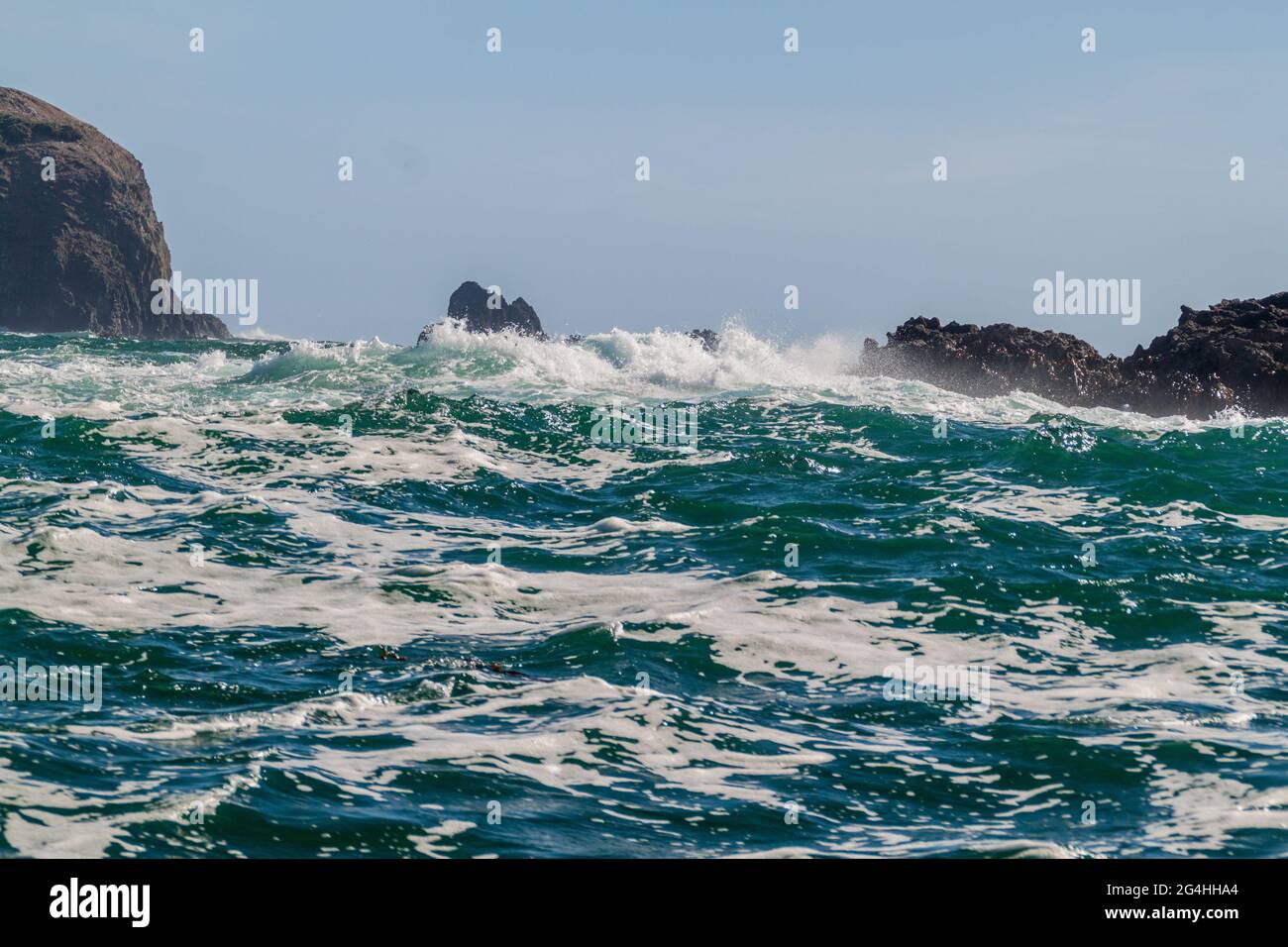 Big waves splash on islets in protected area Monumento Nacional Islotes ...