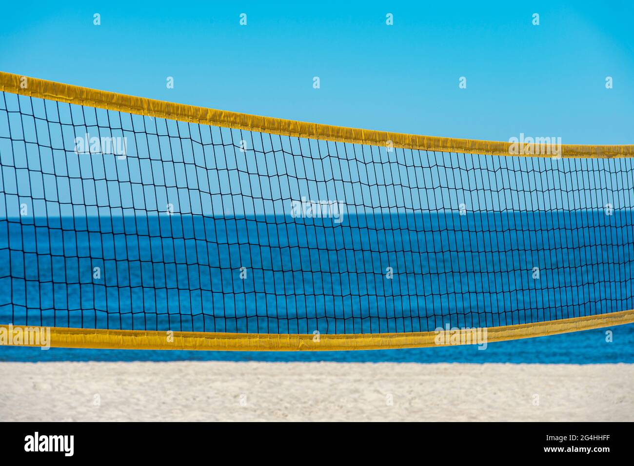 Beach volleyball court with an ocean background. Summer sport concept ...