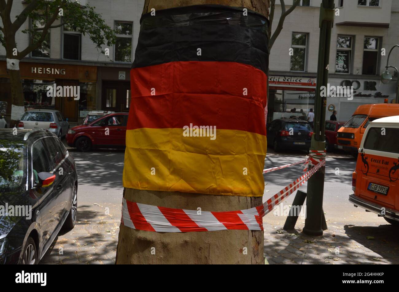 German flag hung on a tree at Rankestrasse in Berlin, Germany - 21st ...