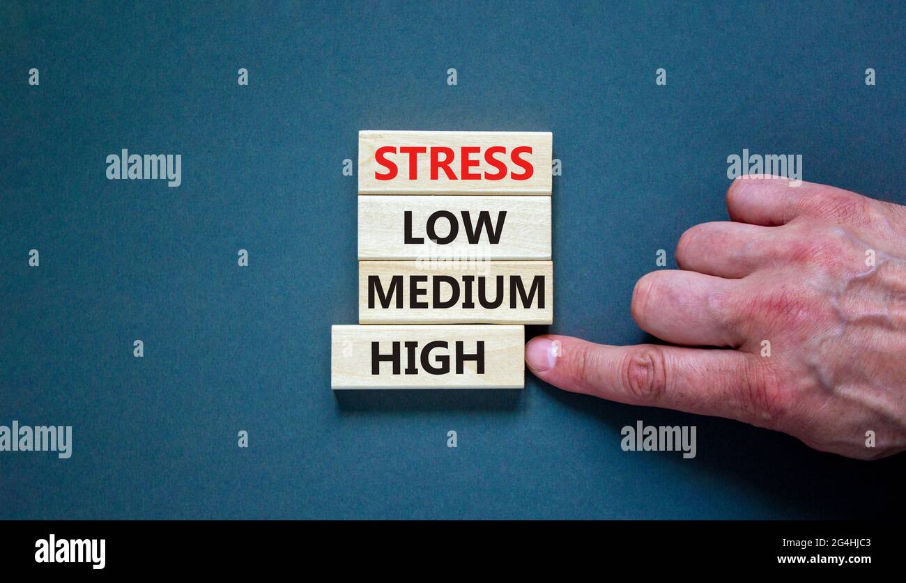 Low or high stress level symbol. Businessman chooses the wooden block ...