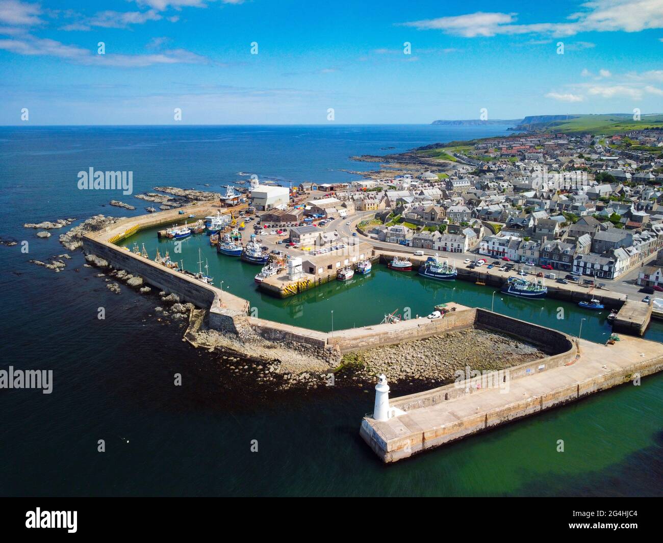 Aerial view from drone of harbour and shipyards at Macduff on Moray ...