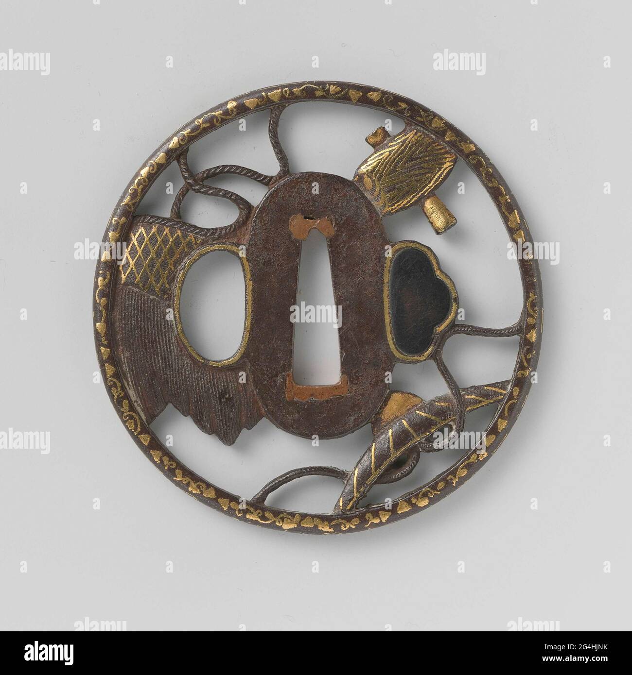 . Round Tsuba with in a positive silhouette and raised relief three of ...