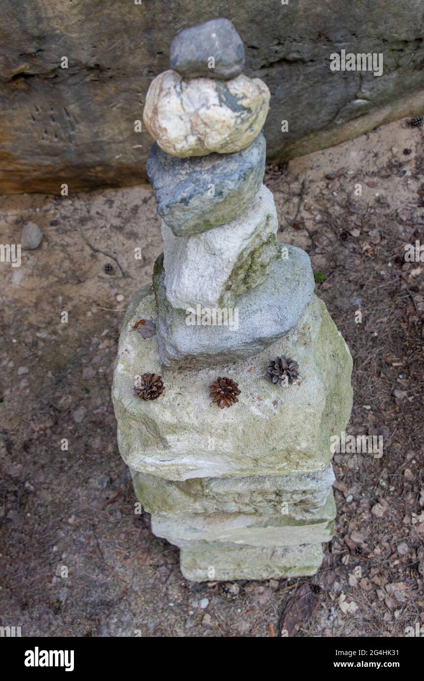 Stones arranged in a tower in nature with rocks Stock Photo - Alamy