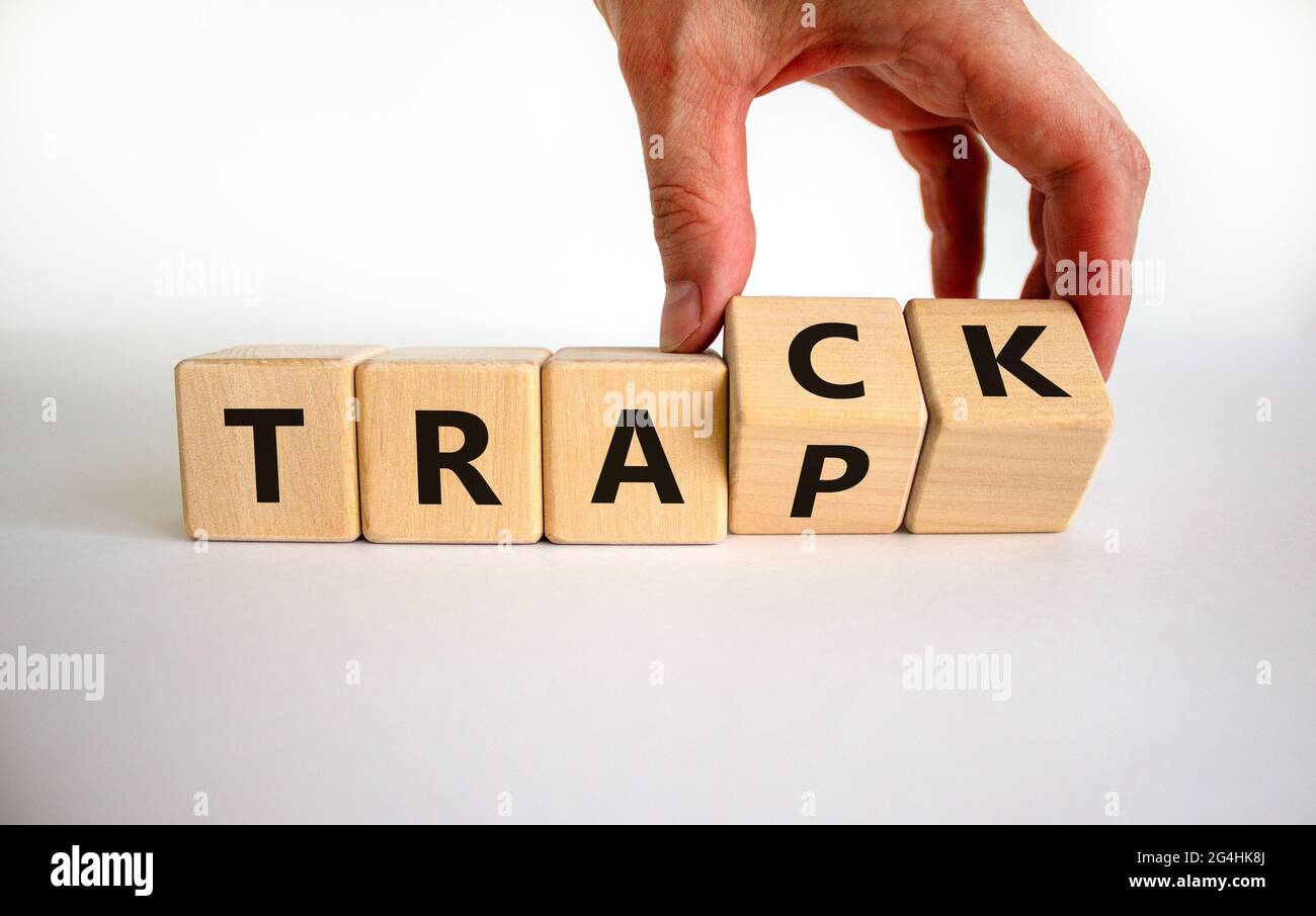 Trap or track symbol. Businessman turns wooden cubes and changes the ...