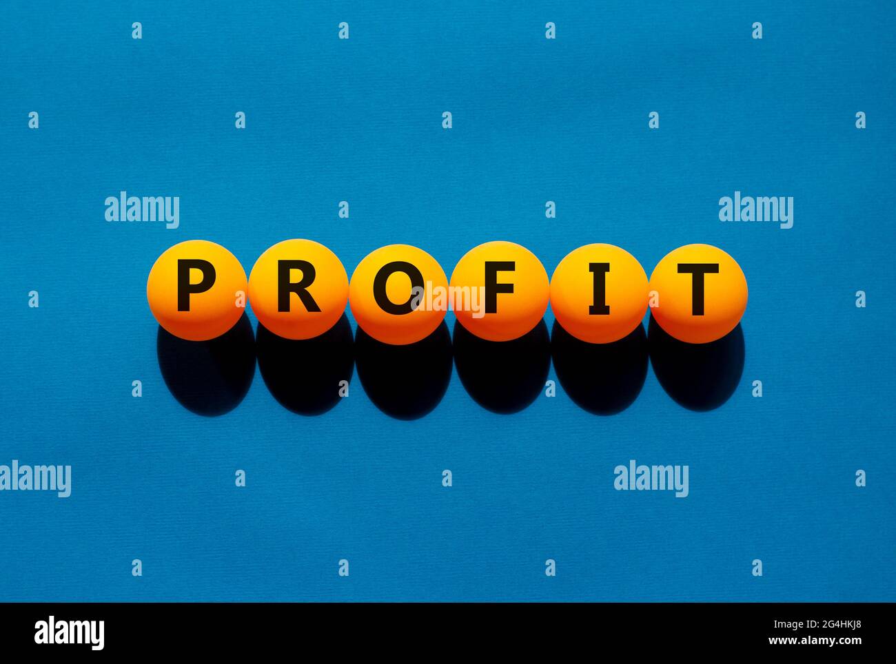 Profit and bonus symbol. The concept word 'profit' on orange table ...
