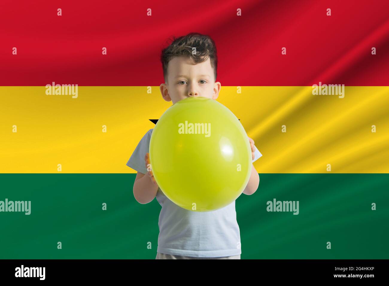 Children's day in Ghana. White boy with a balloon on the background of ...