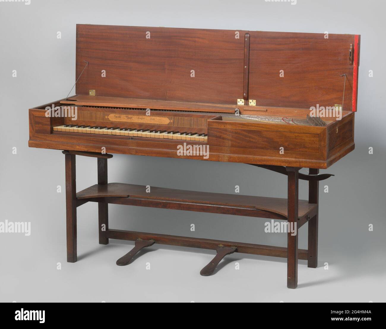 Square piano. Table piano in closet of mahogany wood. The hammers with ...