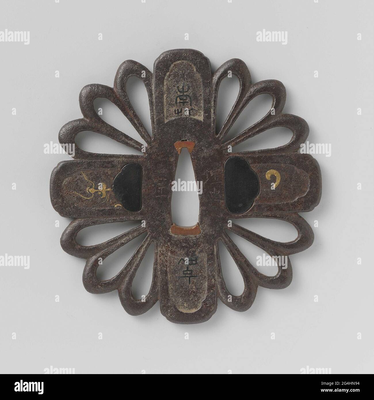 . Tsuba in the form of a Greek cross with three openworked flower ...