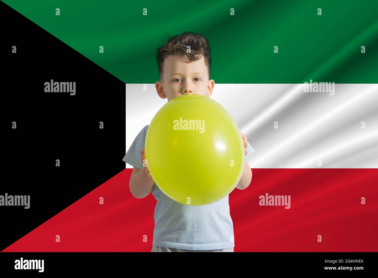 Children's day in Kuwait White boy with a balloon on the background of ...